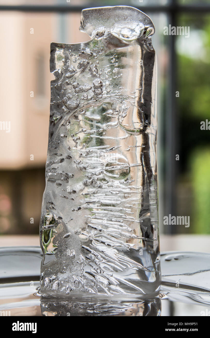 ice cube in a plate Stock Photo - Alamy