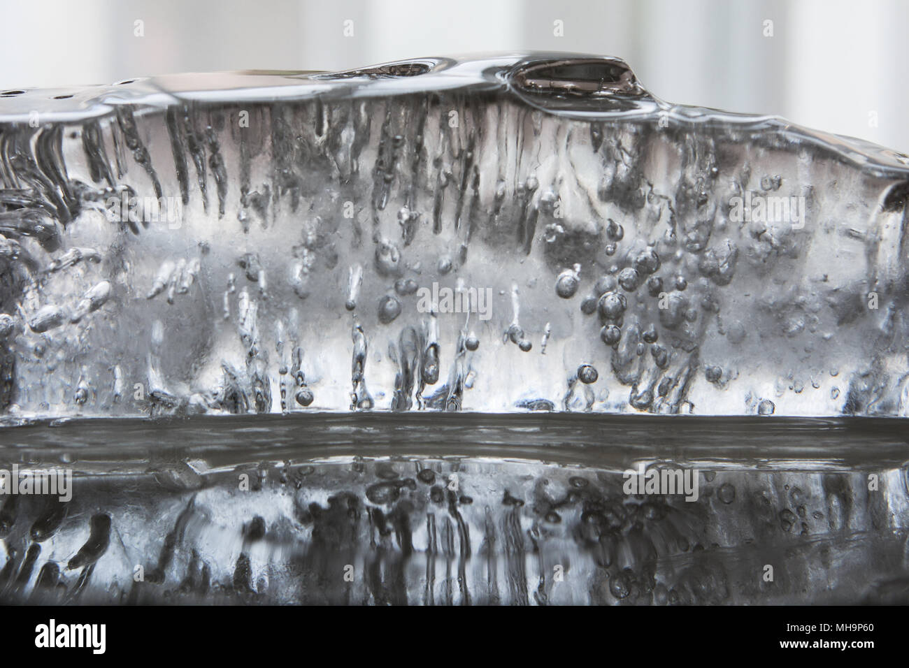 ice cube in a plate Stock Photo - Alamy