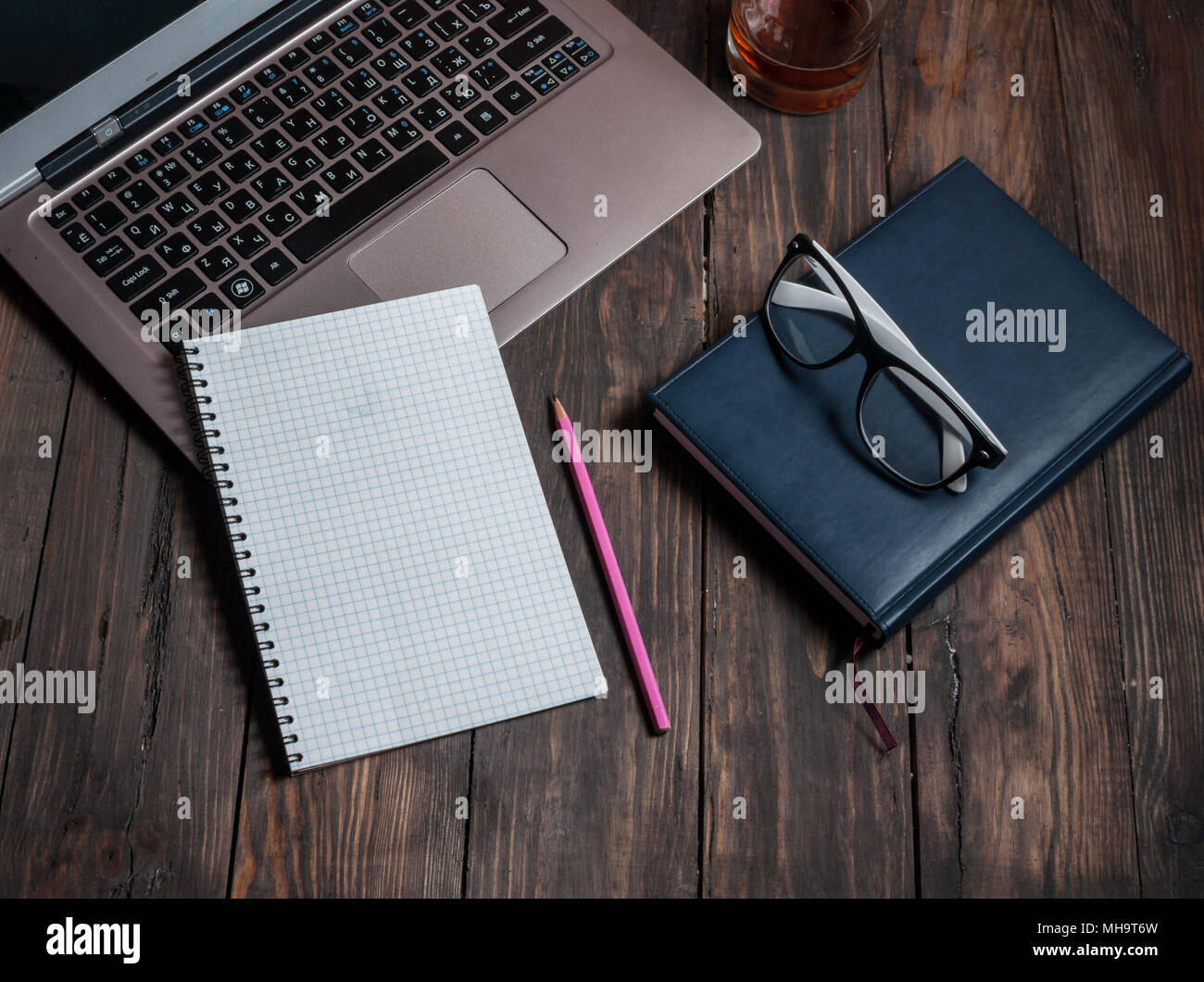 Office wooden table, computer, notebook and spectacles Stock Photo - Alamy