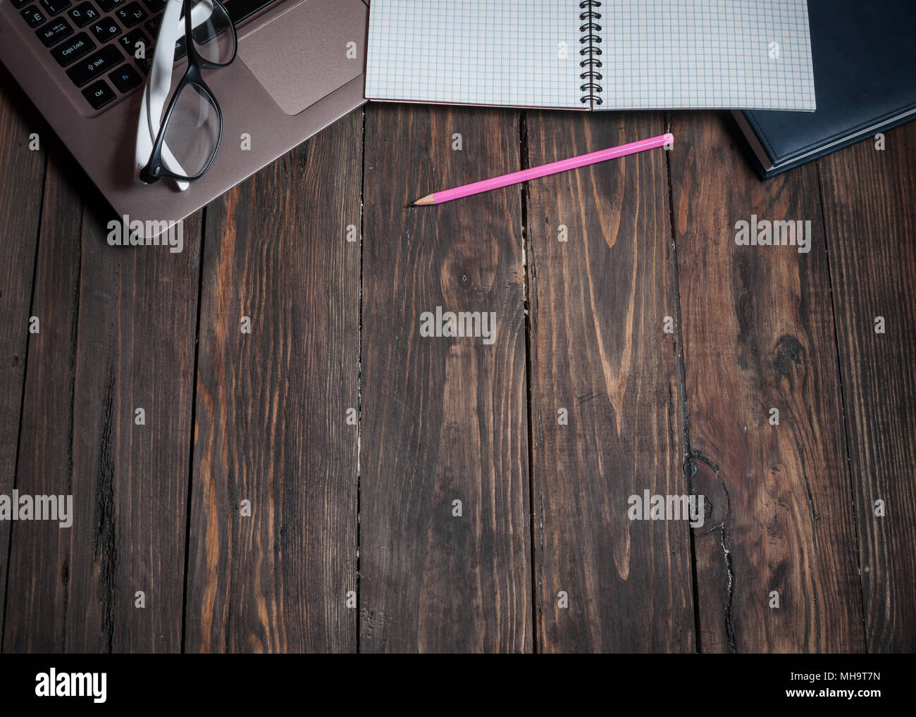 Office wooden table with tablet, computer, notebook and spectacles, top ...