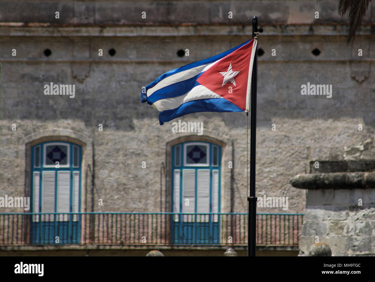 A Cuban flag flies over the historic neighborhood of Havana Vieja in ...