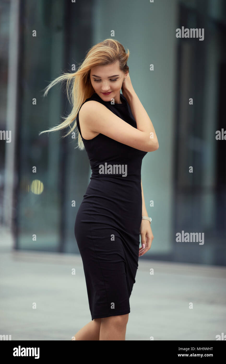 Pretty girl walking on the street from work Stock Photo - Alamy