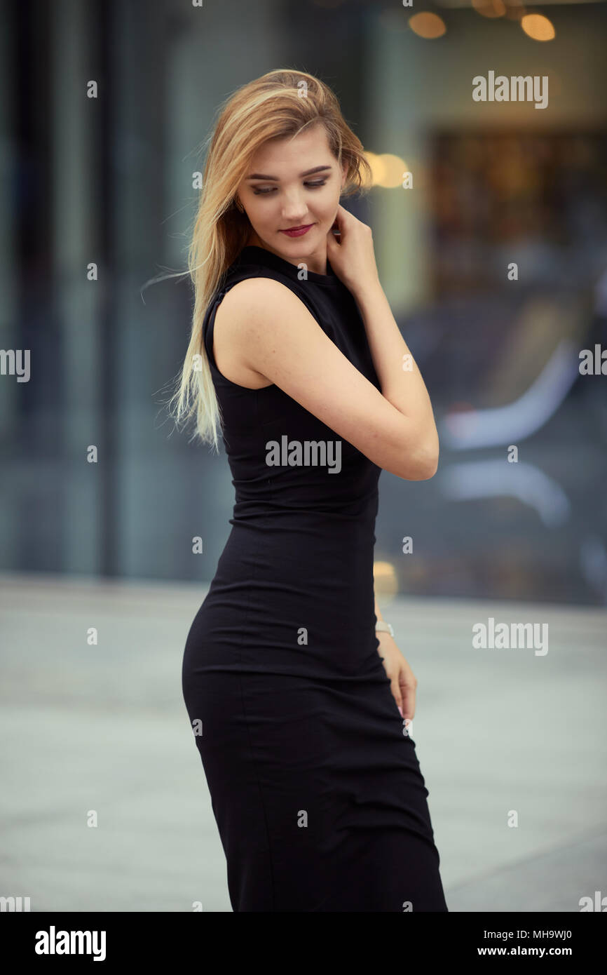 Pretty girl walking on the street from work Stock Photo - Alamy