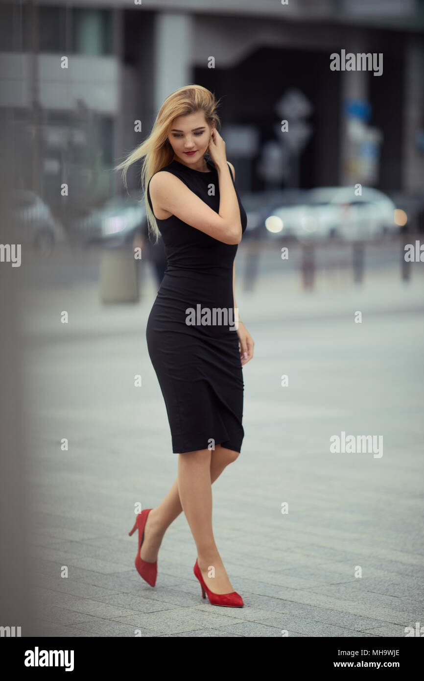 Pretty girl walking on the street from work Stock Photo - Alamy
