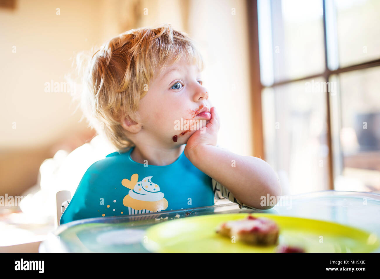 A toddler boy eating at home Stock Photo - Alamy
