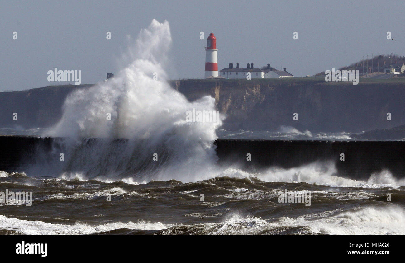 Waves crash over the sea wall at Tynemouth, Northumberland Stock Photo ...