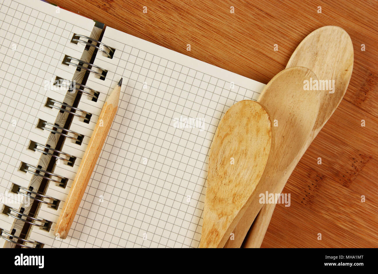 notebook for culinary recipes on a kitchen cutting board Stock Photo ...