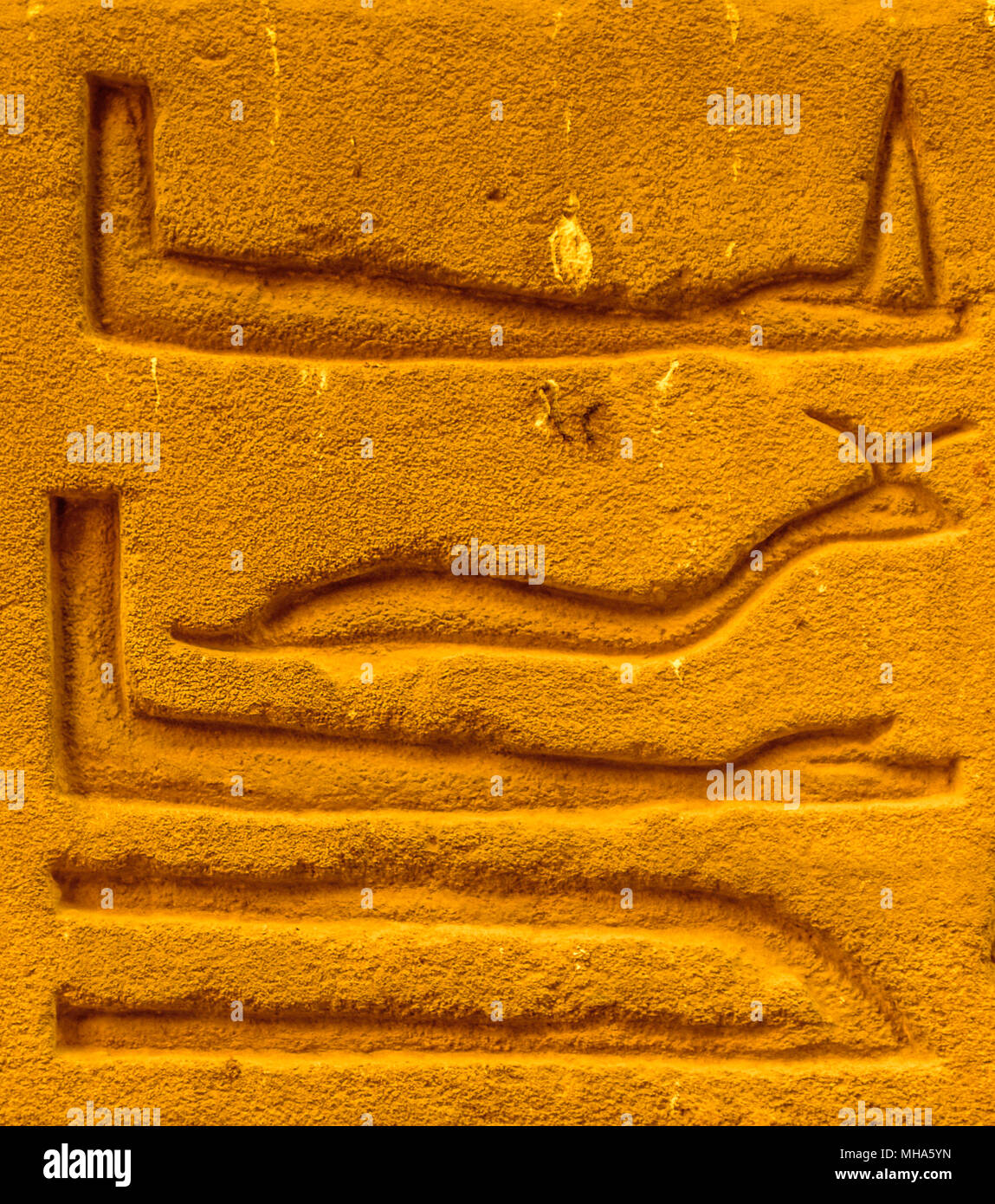 Egyptian hieroglyphs on the wall in a temple Stock Photo - Alamy