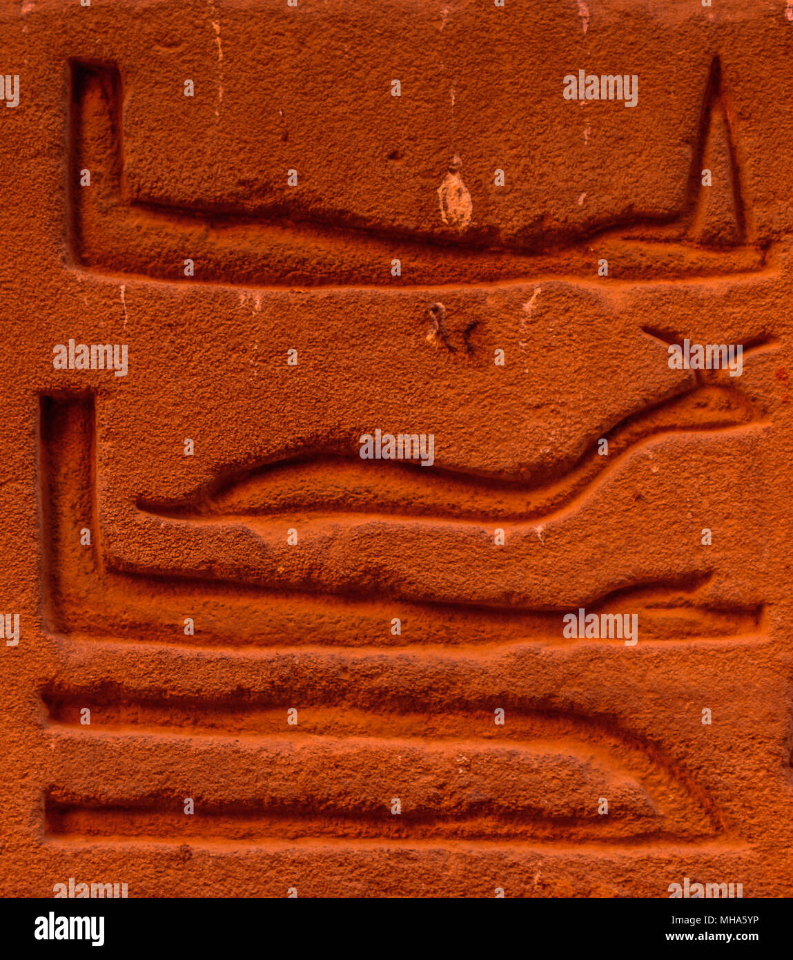 Egyptian hieroglyphs on the wall in a temple Stock Photo - Alamy