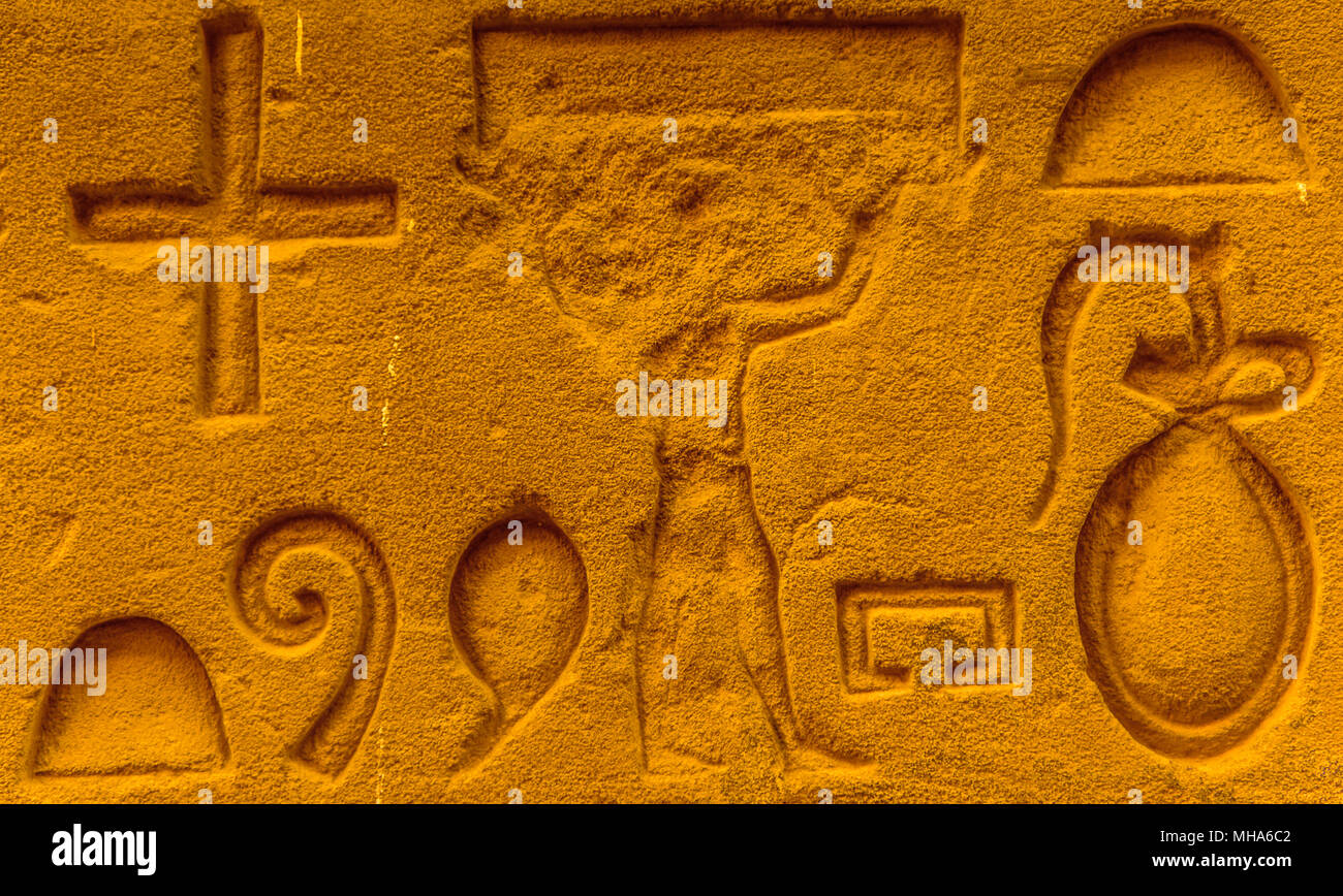 Egyptian hieroglyphs on the wall in a temple Stock Photo - Alamy