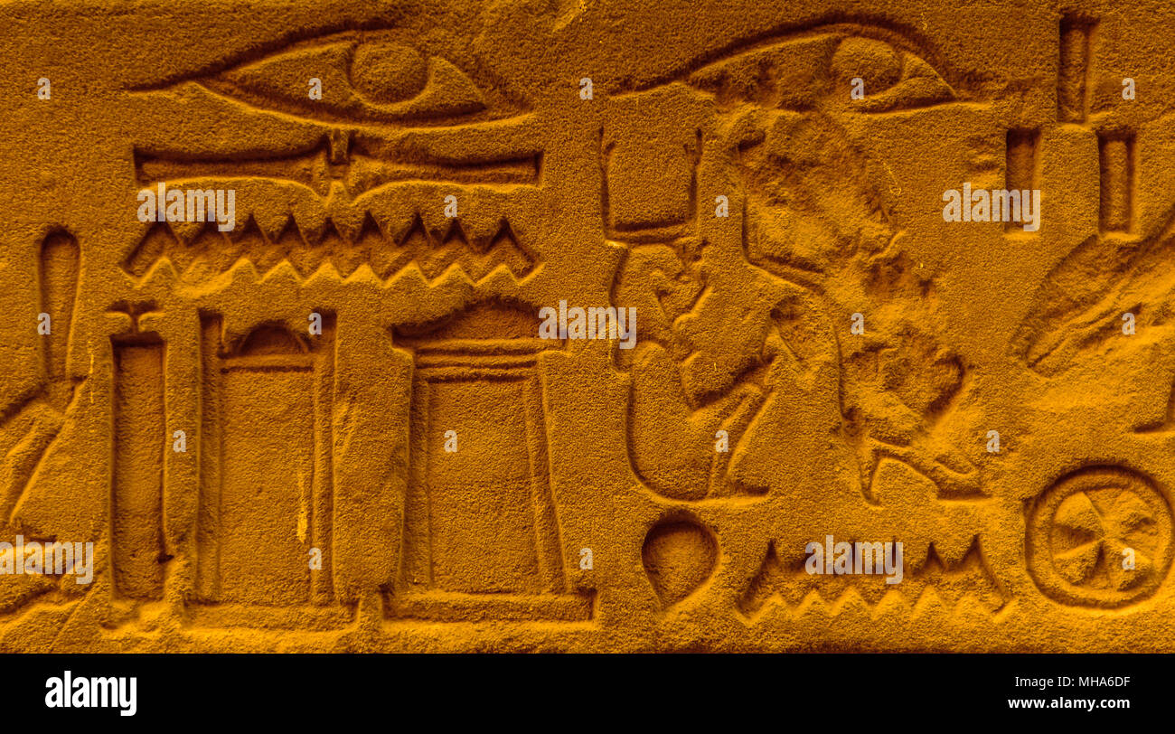 Egyptian hieroglyphs on the wall in a temple Stock Photo - Alamy