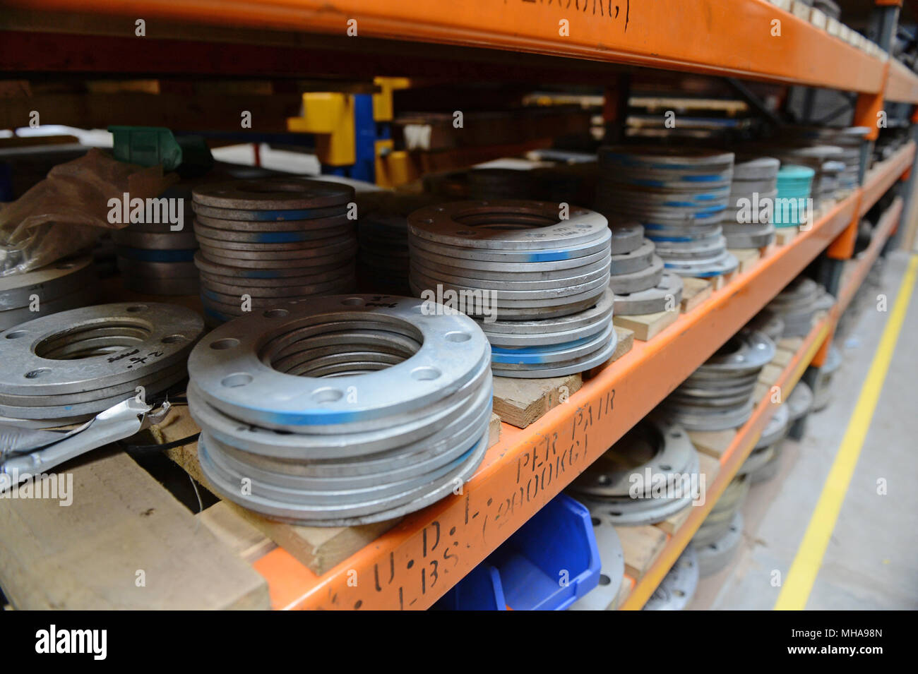 Engineering workshop store with flanges joints and stainless steel ...