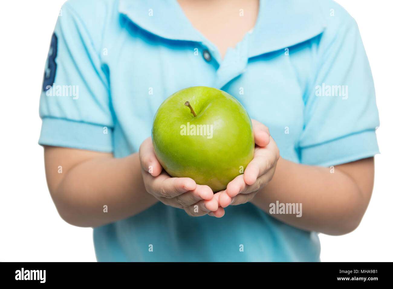 Hands of baby boy holding green apple, isolated on white Stock Photo ...
