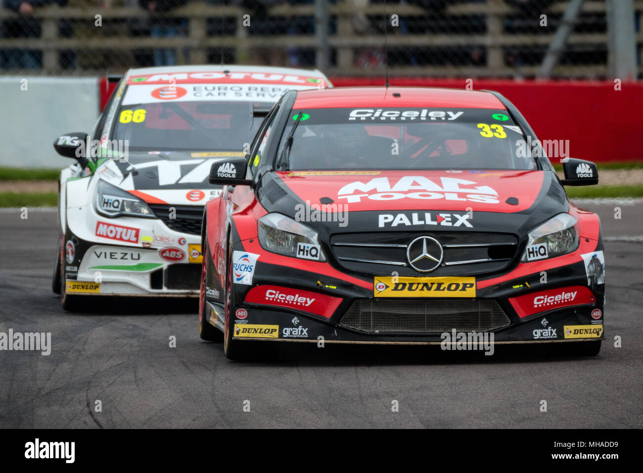 Donington Park, Derbyshire, UK. 29th April 2018. Adam Morgan holds off ...