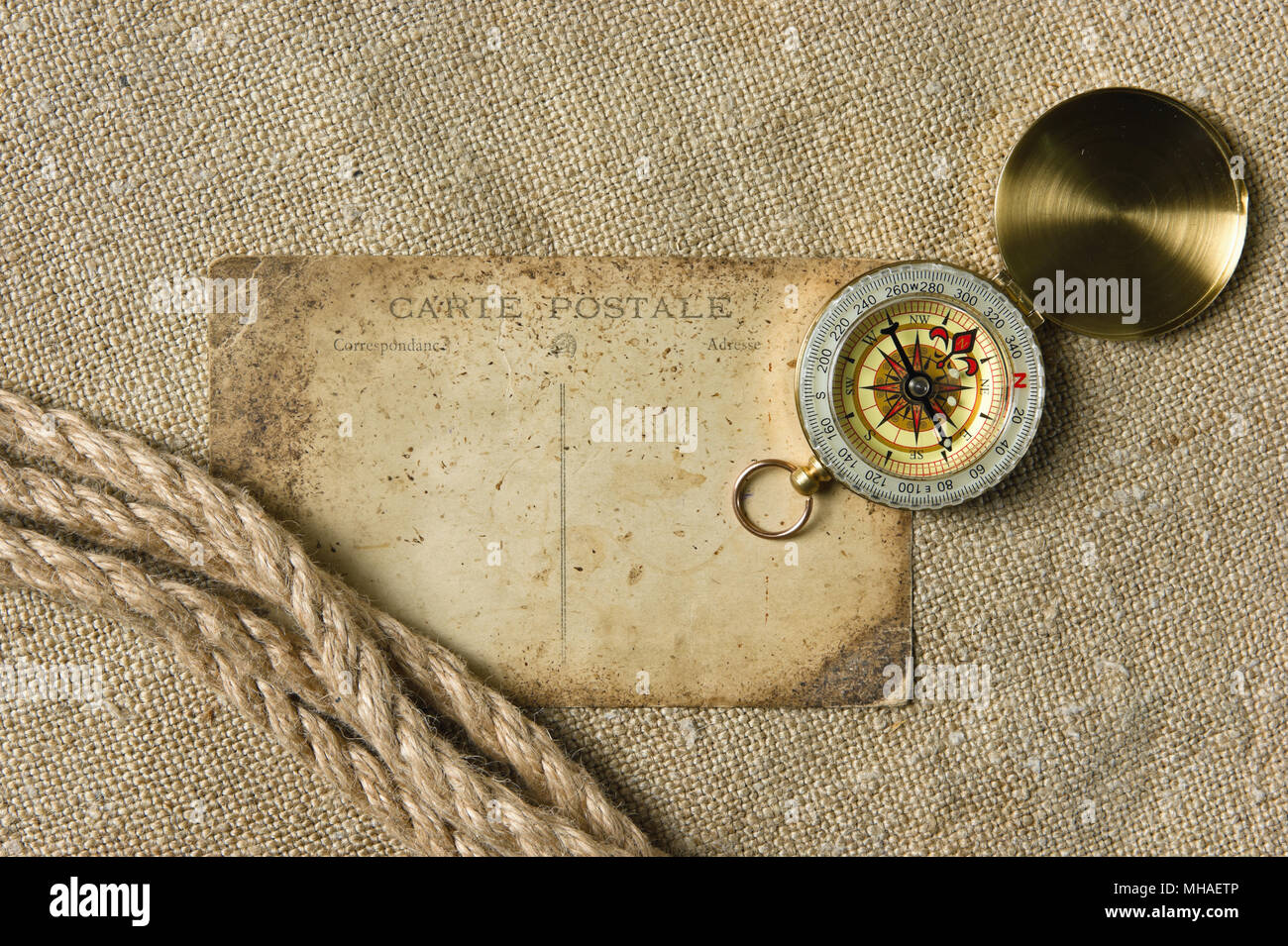 Vintage background with old paper and compass Stock Photo - Alamy