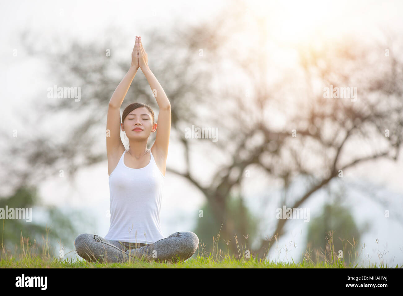 Lady practicing yoga hi-res stock photography and images - Alamy