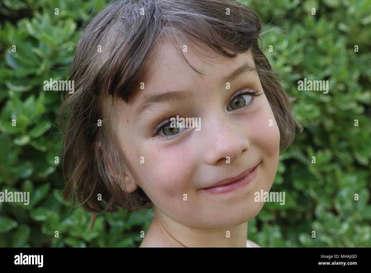 Girl mischievous smile hi-res stock photography and images - Alamy