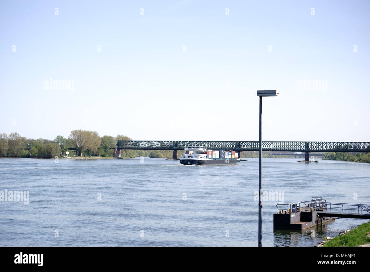 A container ship drives under the south bridge in Mainz on the river ...