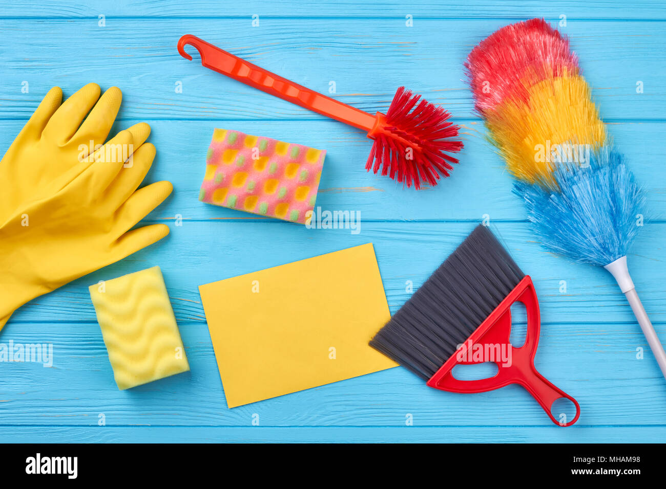 Colorful objects for cleaning on blue background Stock Photo - Alamy