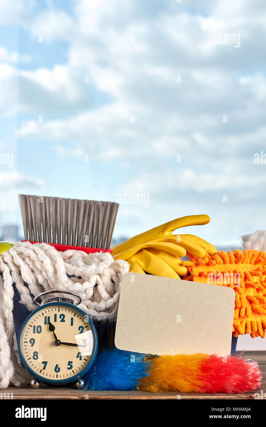 Cleaning products and alarm clock Stock Photo - Alamy