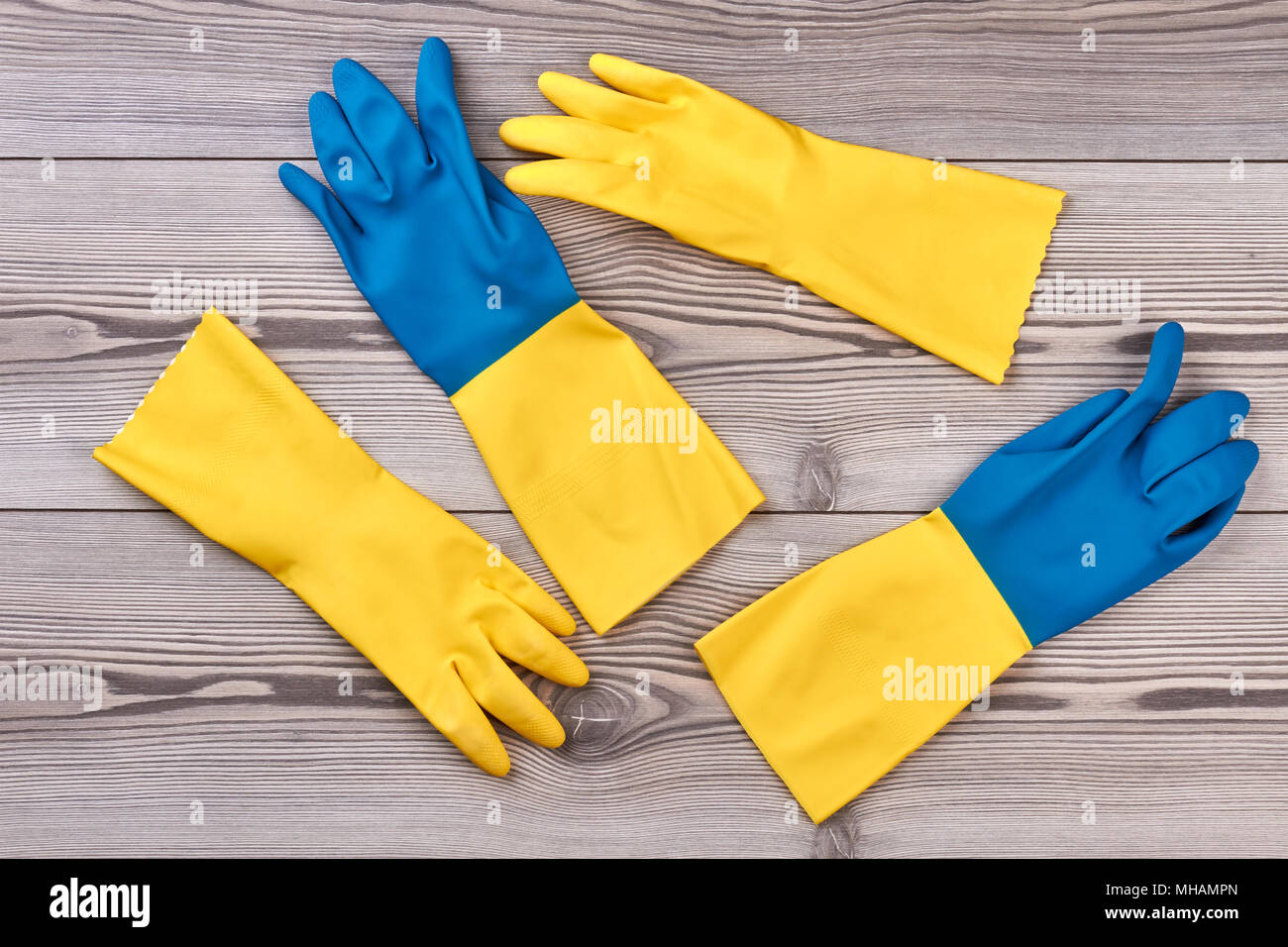 Yellow and blue rubber gloves Stock Photo - Alamy