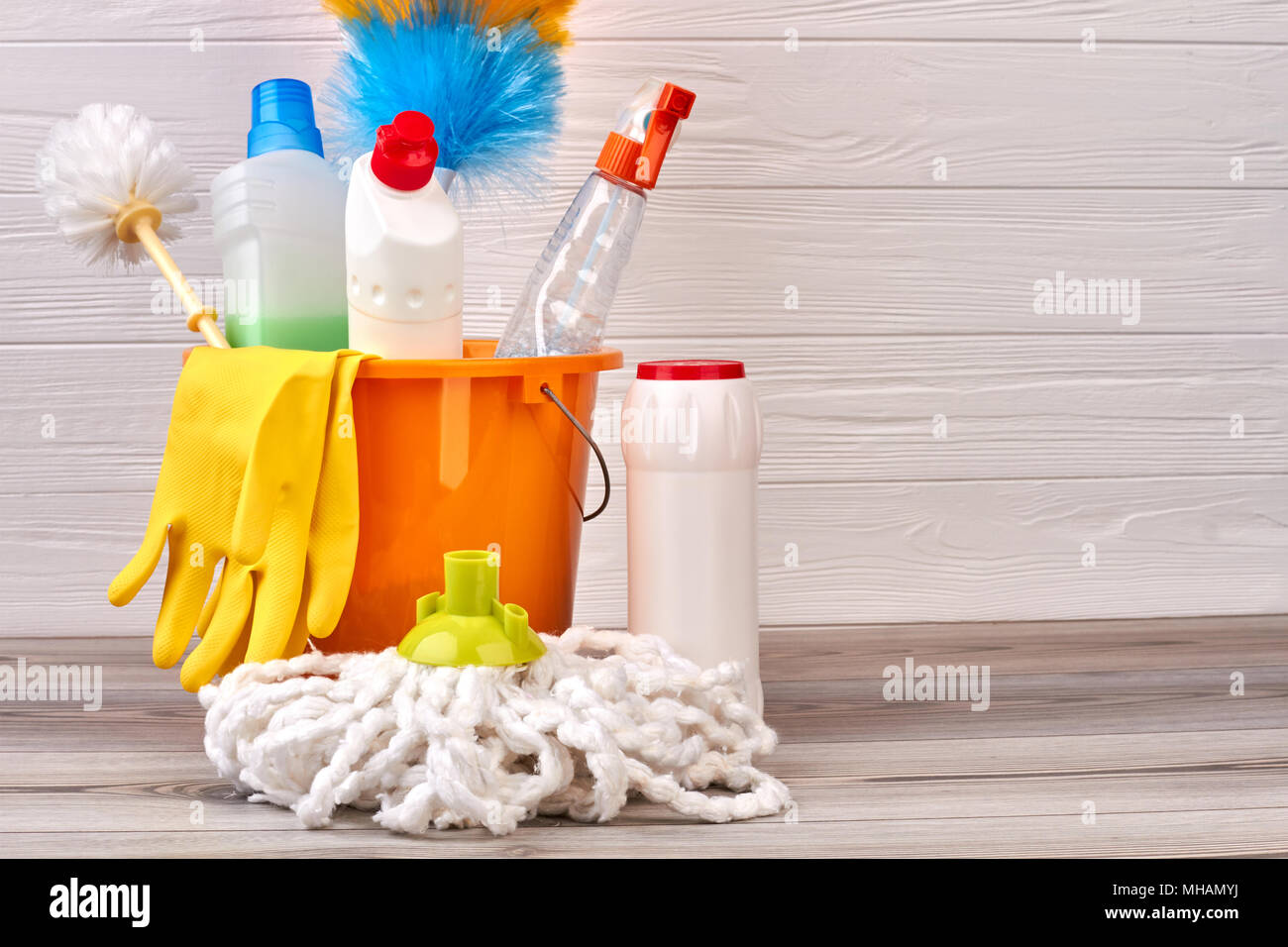 Assortment of cleaning items in bucket Stock Photo - Alamy