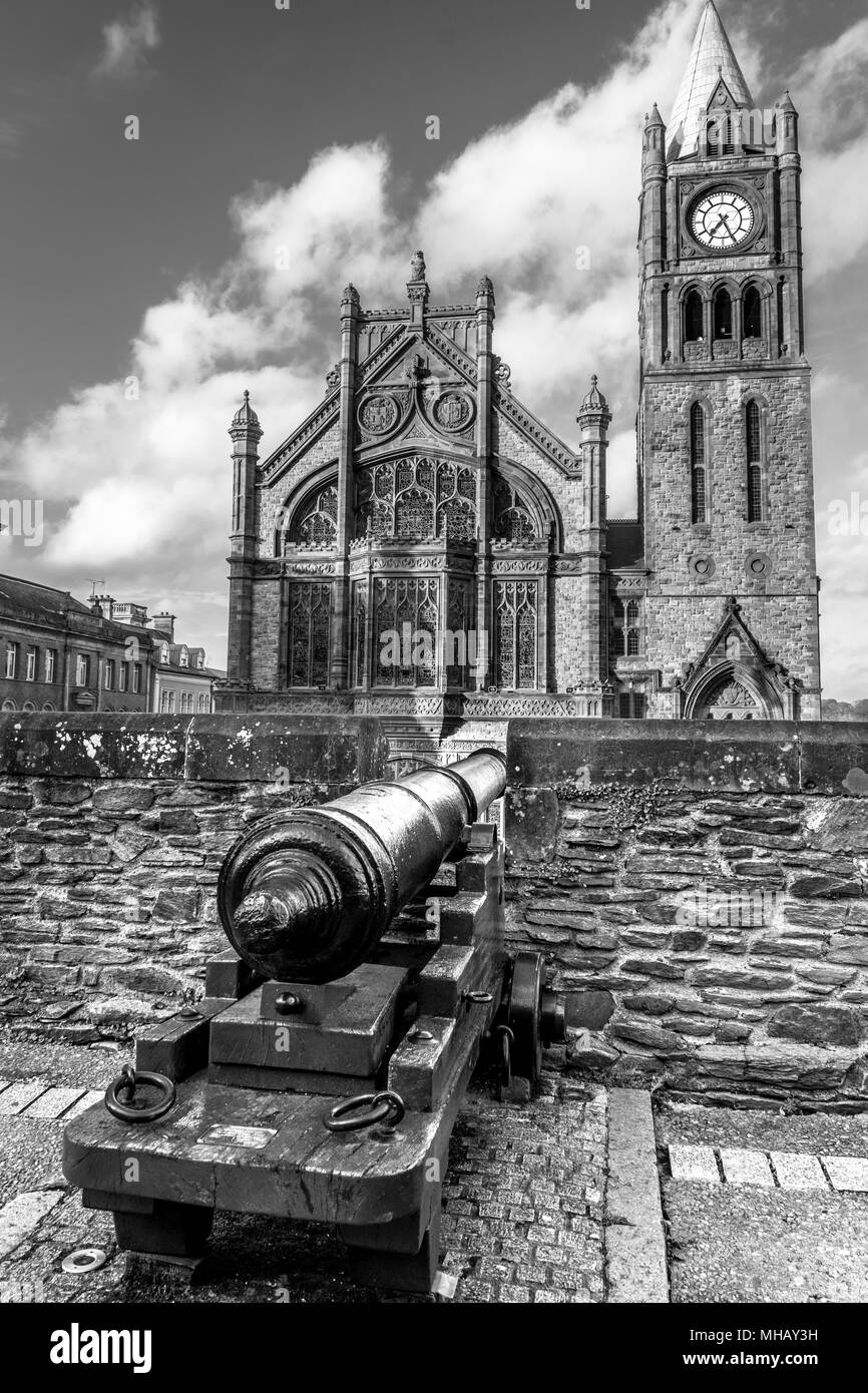 THis is a black and white photograph of one of Derry's old cannons on ...