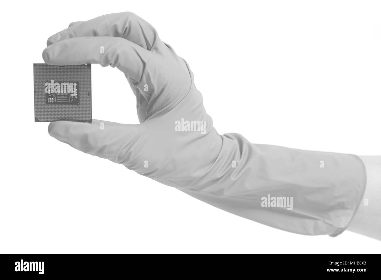 Hand wearing gloves holding a CPU computer processor microchip isolated ...