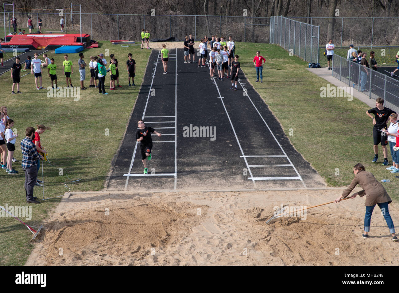Middle school youth participate in a track and field meet at Middleton ...