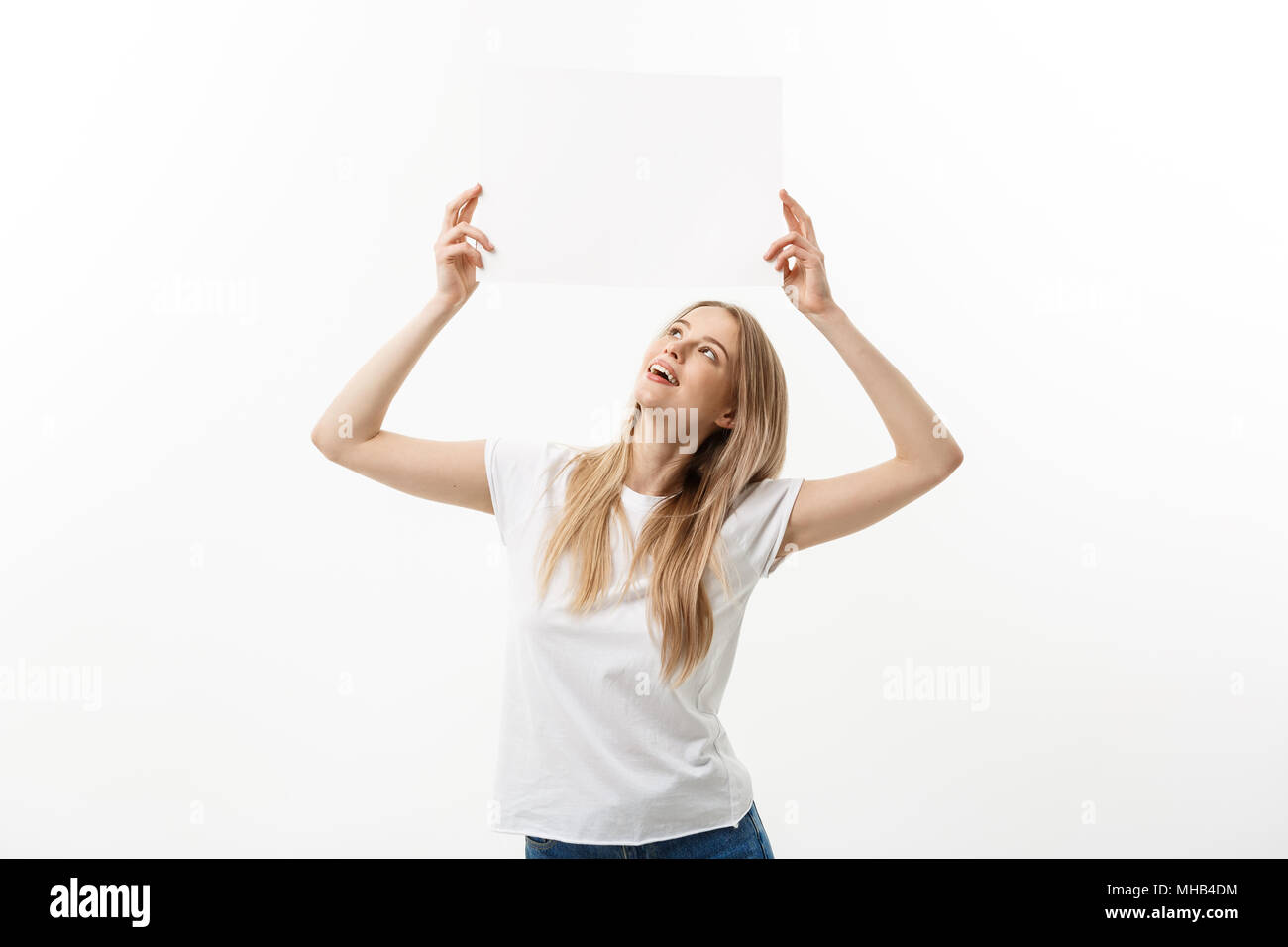 Holding sign above head hi-res stock photography and images - Alamy