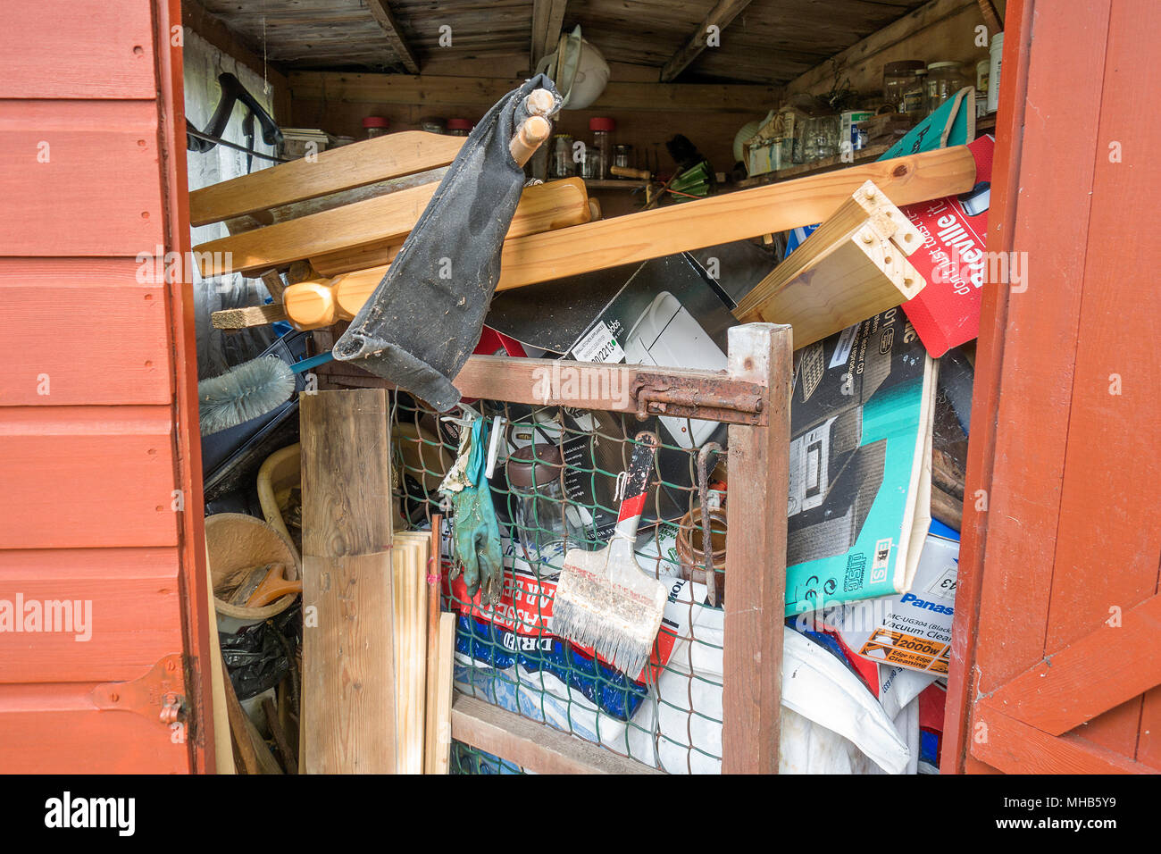 garden shed full packed tools household items junk Stock Photo - Alamy