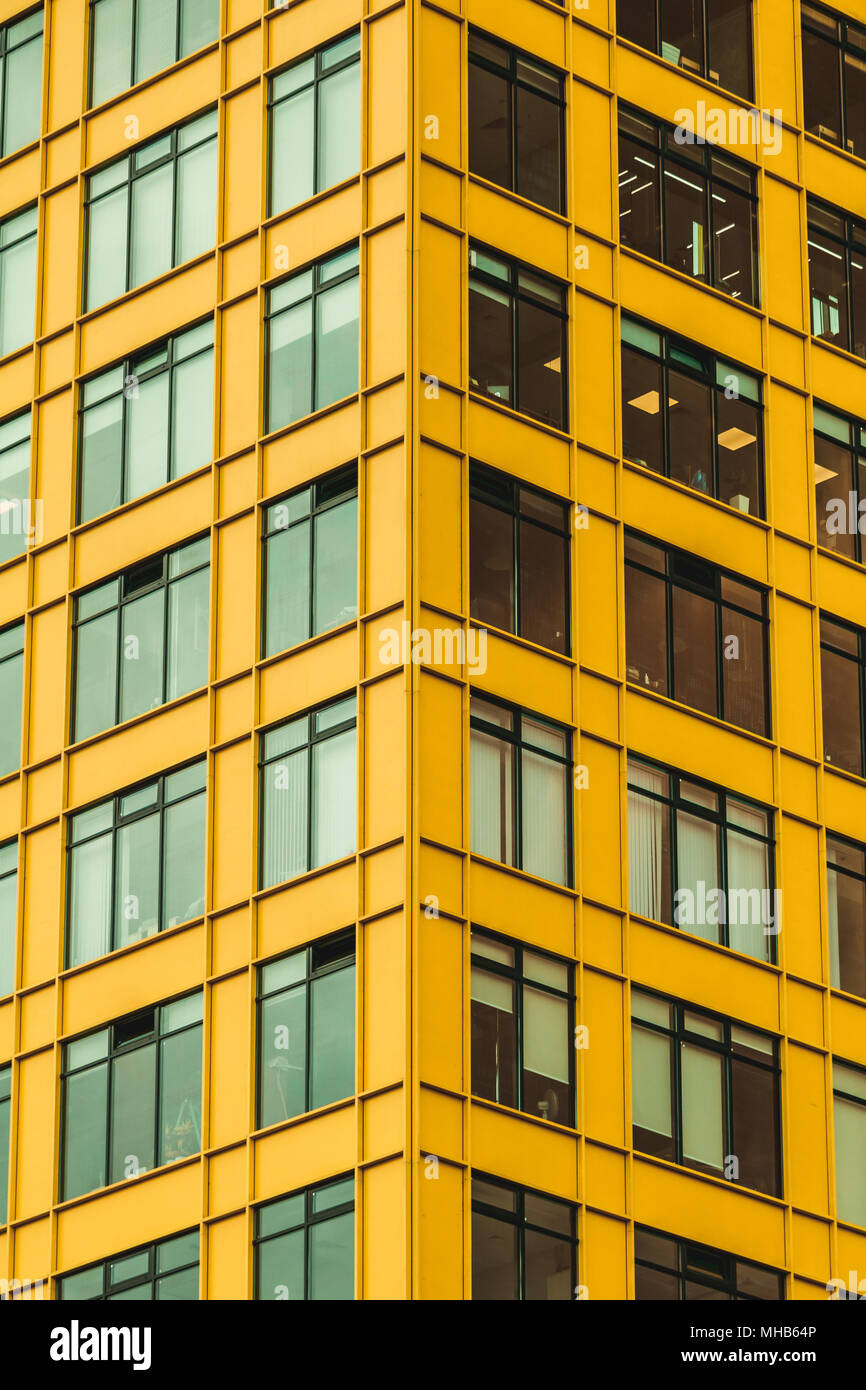 Exterior of a yellow modern building Stock Photo - Alamy