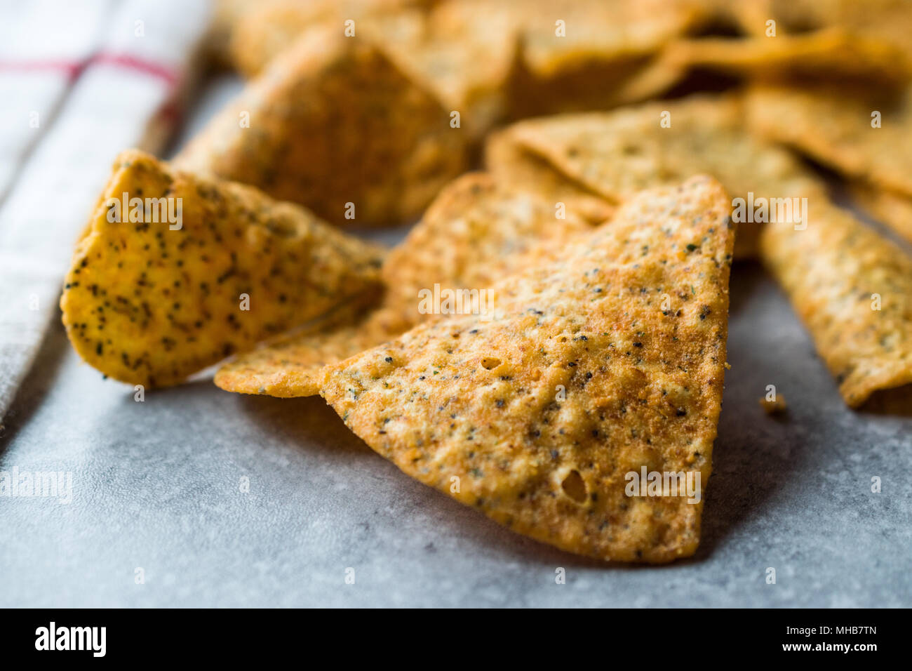 Triangle Corn Chips with Poppy Seeds. Turkish Snackers Stock Photo - Alamy