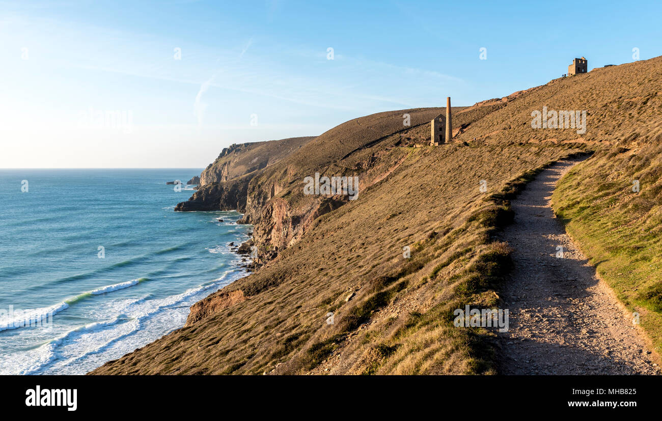Cornish coastal path, in the summer, with a derelict tin mine in the ...