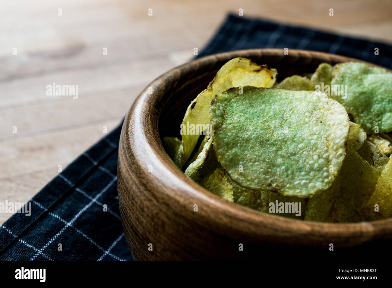 Wasabi Chips in a wooden bowl. Snacks Concept Stock Photo - Alamy