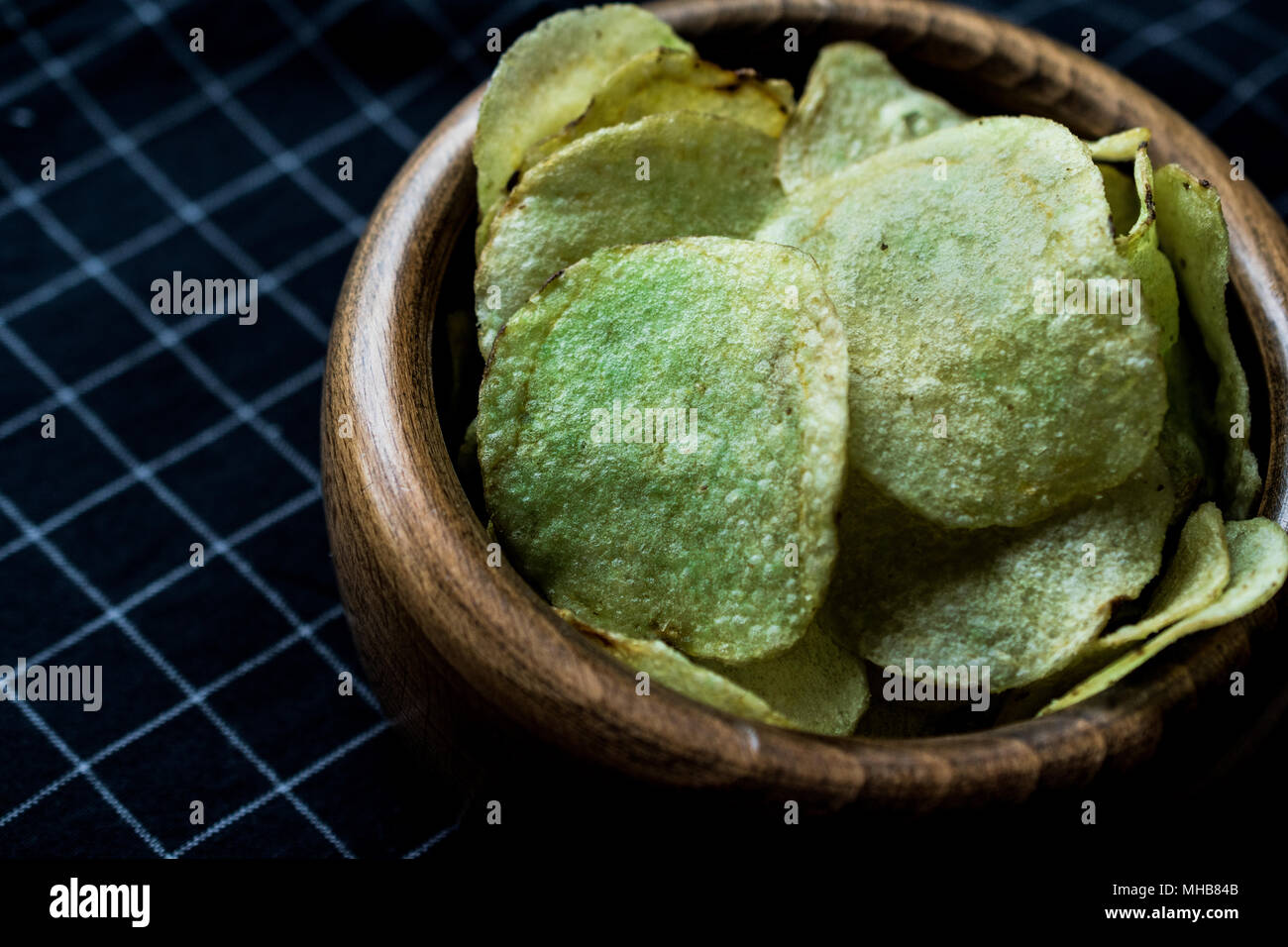 Wasabi Chips in a wooden bowl. Snacks Concept Stock Photo - Alamy