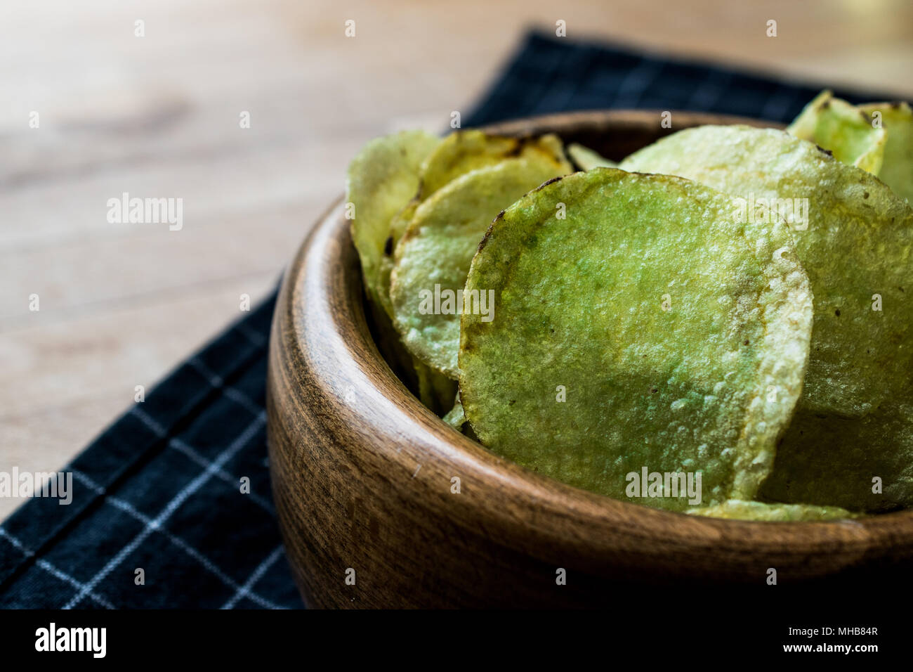 Wasabi Chips in a wooden bowl. Snacks Concept Stock Photo - Alamy