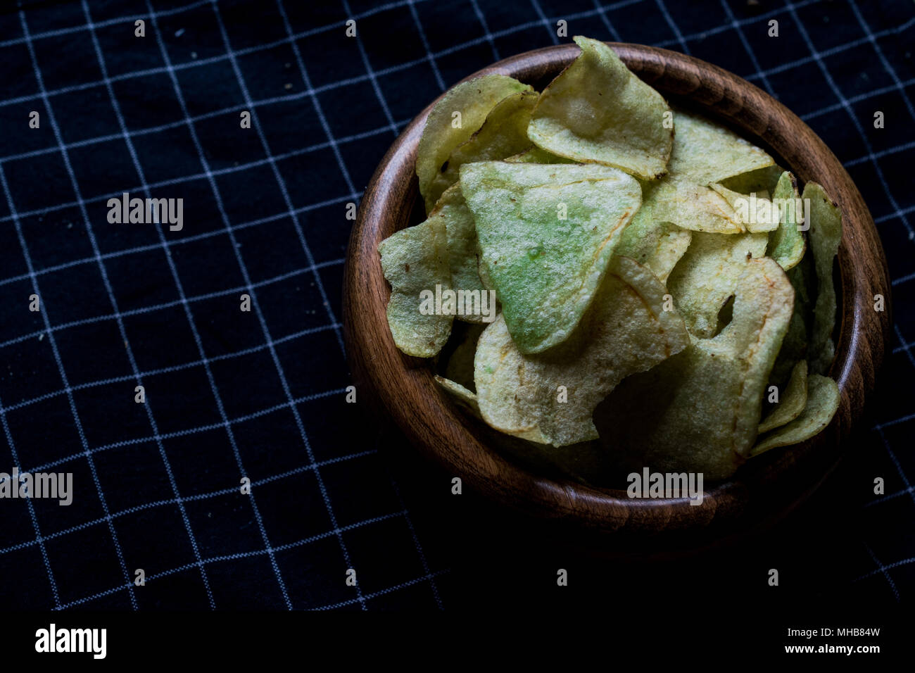 Wasabi Chips in a wooden bowl. Snacks Concept Stock Photo - Alamy