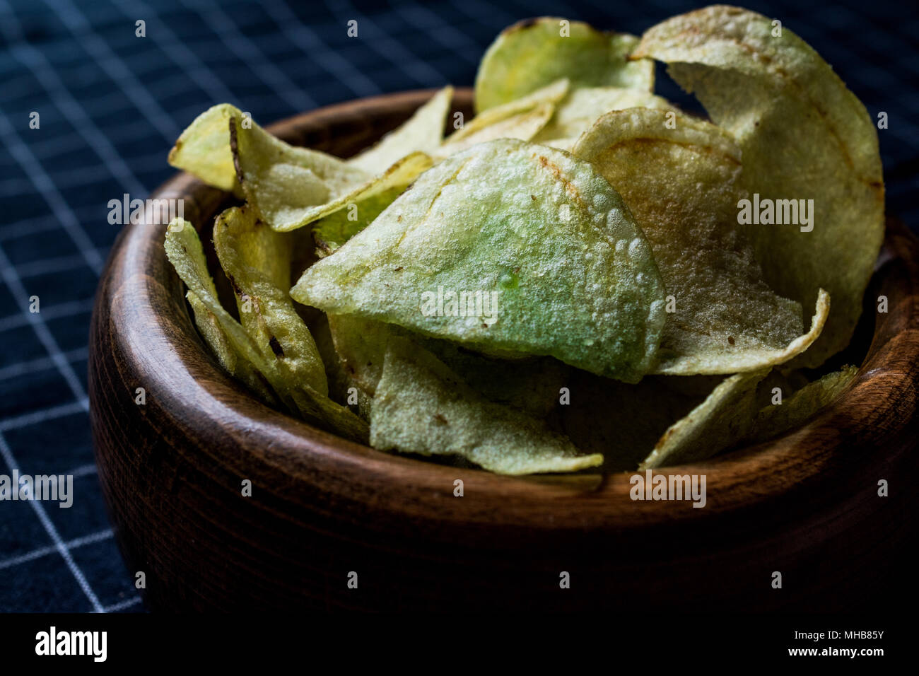 Wasabi Chips in a wooden bowl. Snacks Concept Stock Photo - Alamy