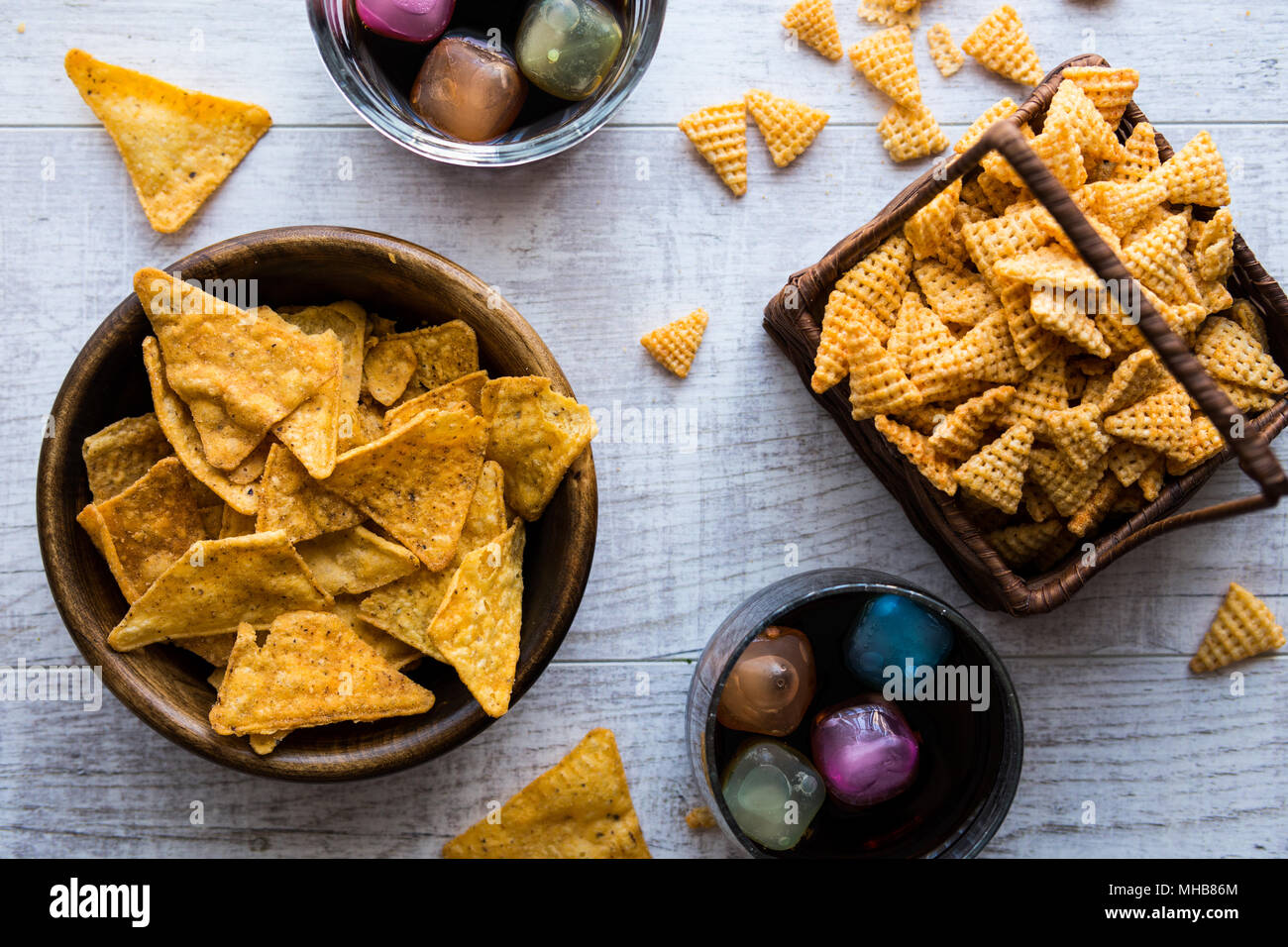 Chips (Snacks) and Beverage on a white wooden surface. (Party Style ...