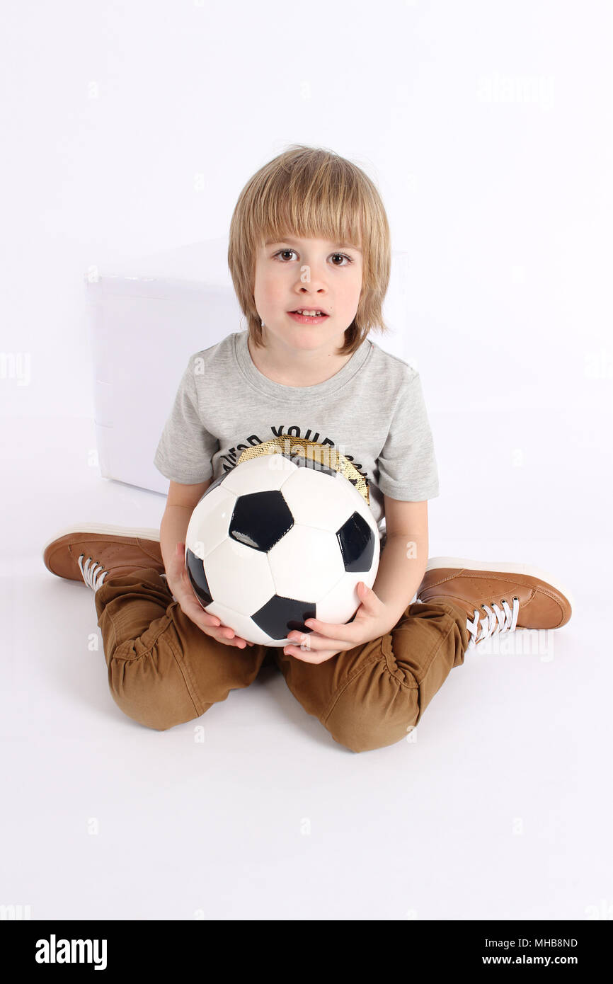 Little boy holding a soccer ball Stock Photo - Alamy