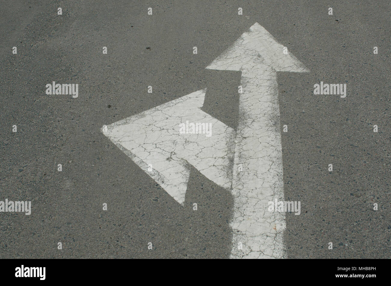 white arrow on the road. Road marking. Forward and right signs on the ...