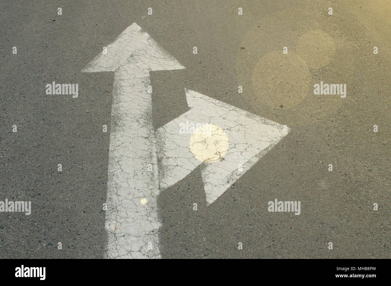 white arrow on the road. Road marking. Forward and right signs on the ...