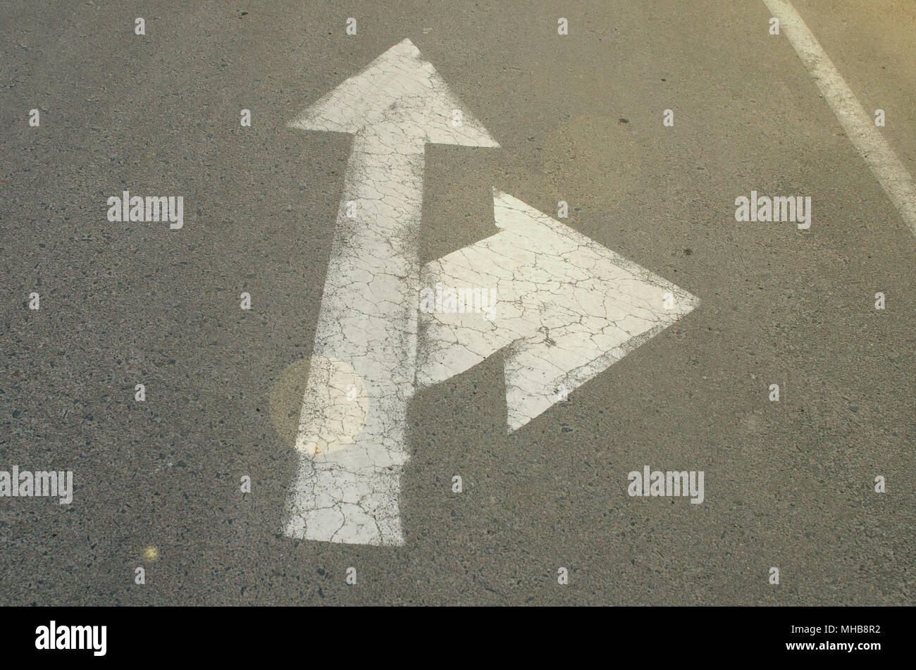 white arrow on the road. Road marking. Forward and right signs on the ...