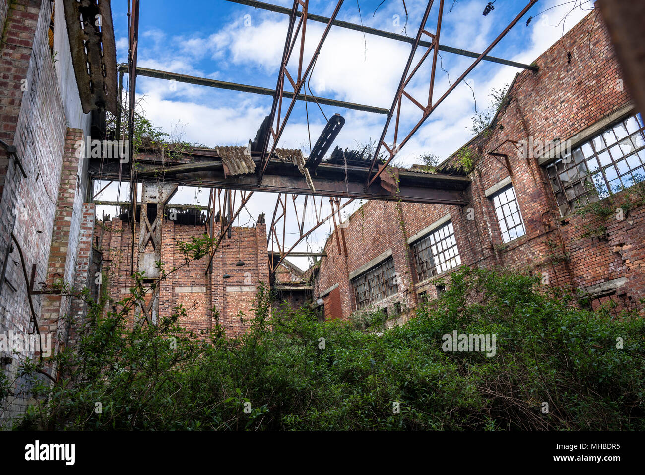 Old industrial brick warehouse with exposed roof girders Stock Photo ...