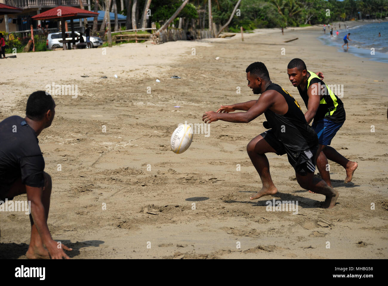 Fijian men playing rugby on Palm Beach, Pacific Harbour, Fiji Stock ...