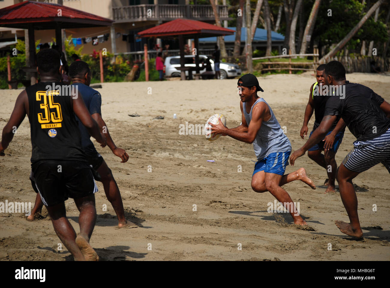 Fijian men playing rugby on Palm Beach, Pacific Harbour, Fiji Stock ...