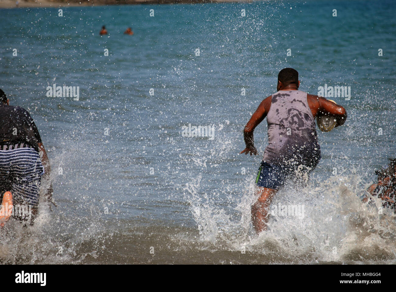 Fijian men playing rugby on Palm Beach, Pacific Harbour, Fiji Stock ...