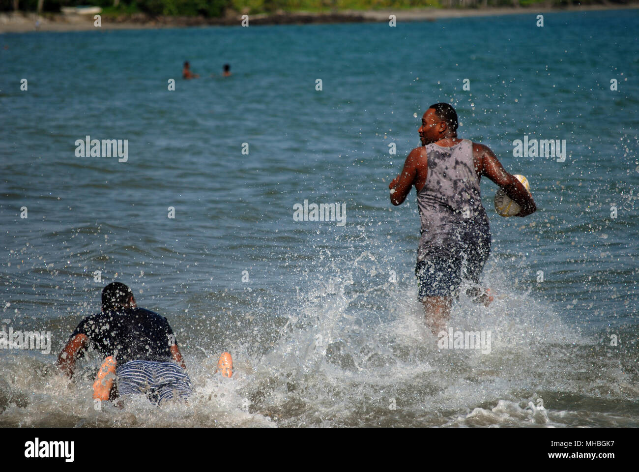Fijian men playing rugby on beach hi-res stock photography and images ...