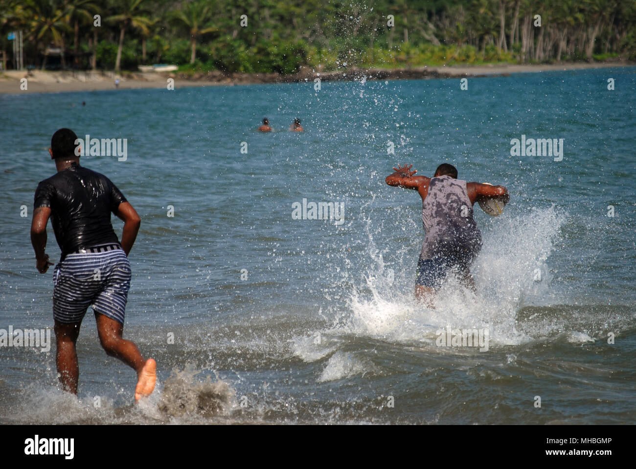 Fijian men playing rugby on beach hi-res stock photography and images ...
